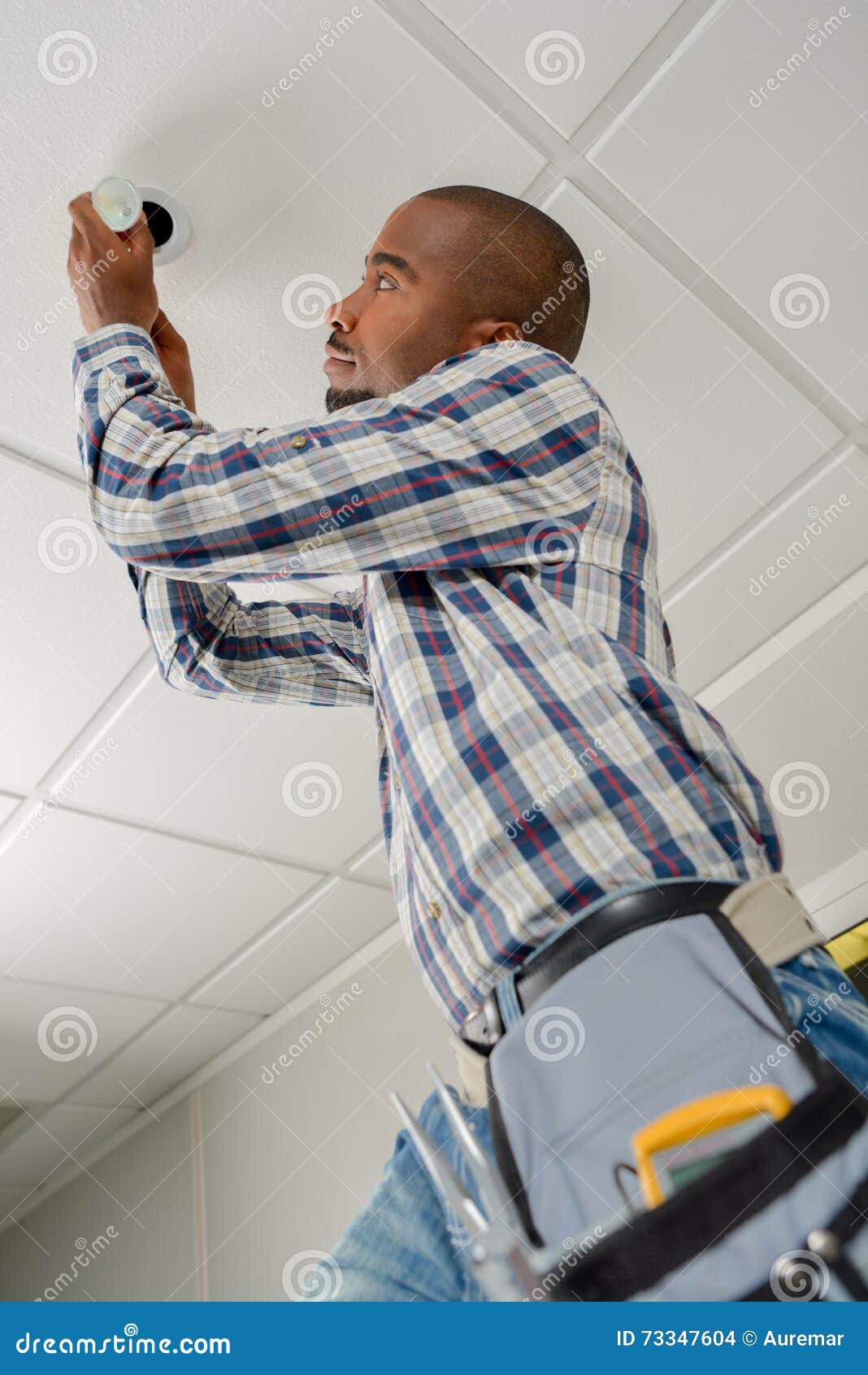 Man up ladder in office stock photo. Image of ceiling - 73347604