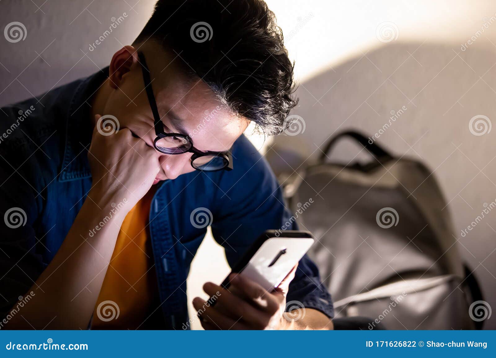 Man Upset while Using Phone Stock Photo - Image of campus, people ...