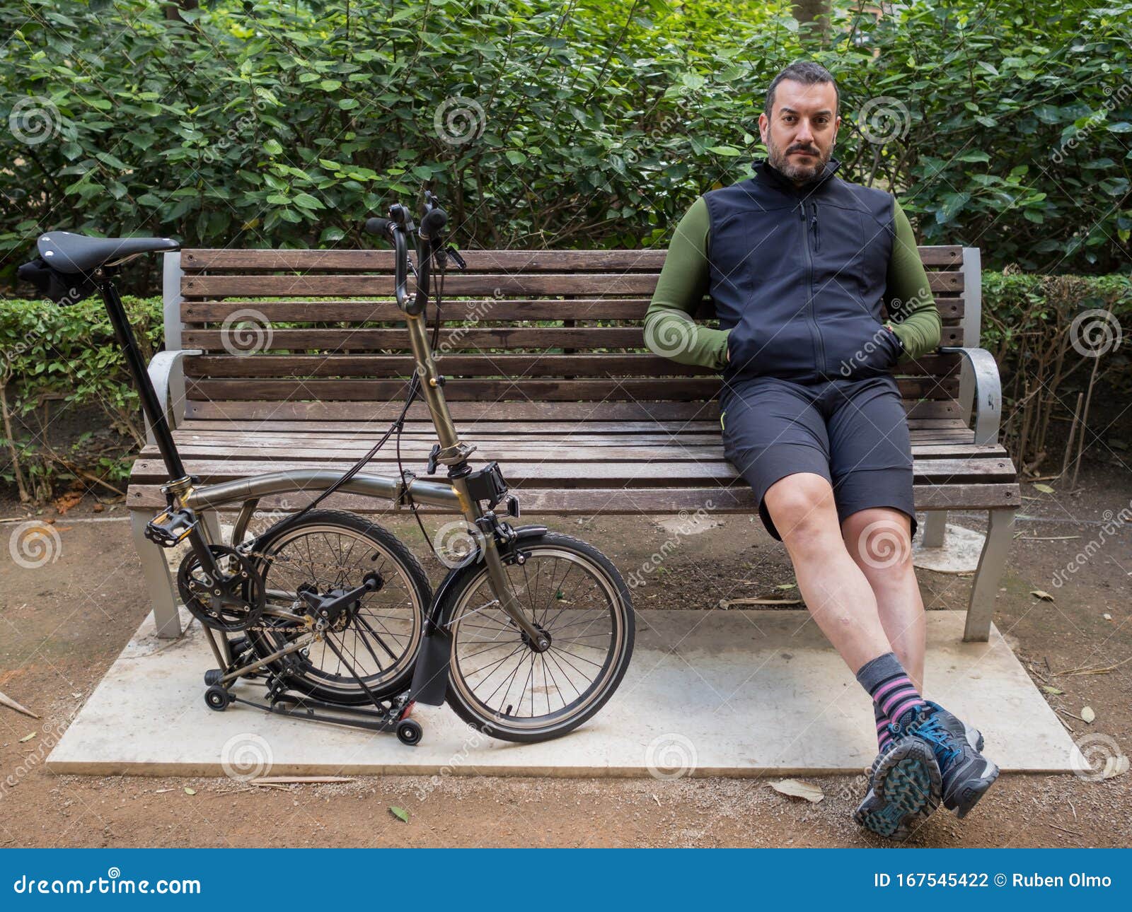Man on an Urban Bike Resting on a Park Bench Stock Photo - Image of ...