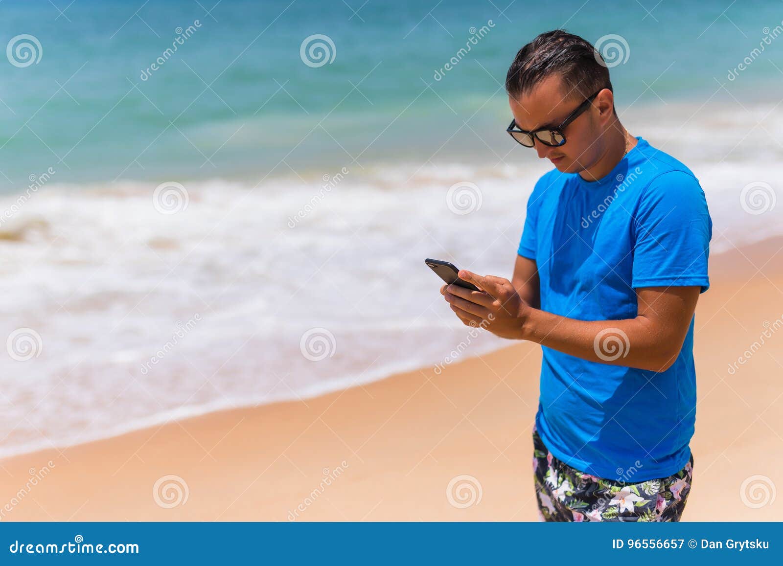 Man Use Phone on the Beach Typing or Use Internet on Sunny Day Stock ...