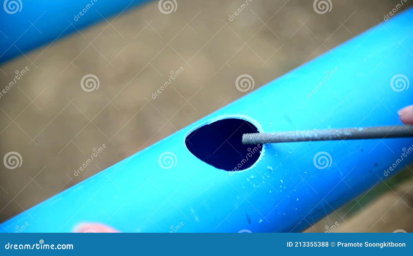 The Man Use Rasp Scratch the Hole at Blue PVC Pipe Stock Footage ...