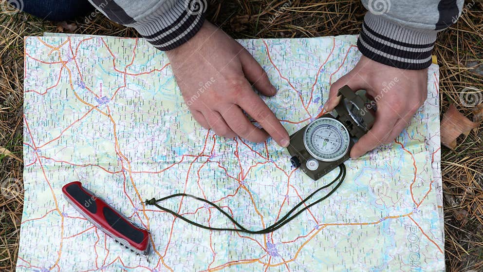 Man Uses a Compass in the Woods Stock Image - Image of hipster, country ...
