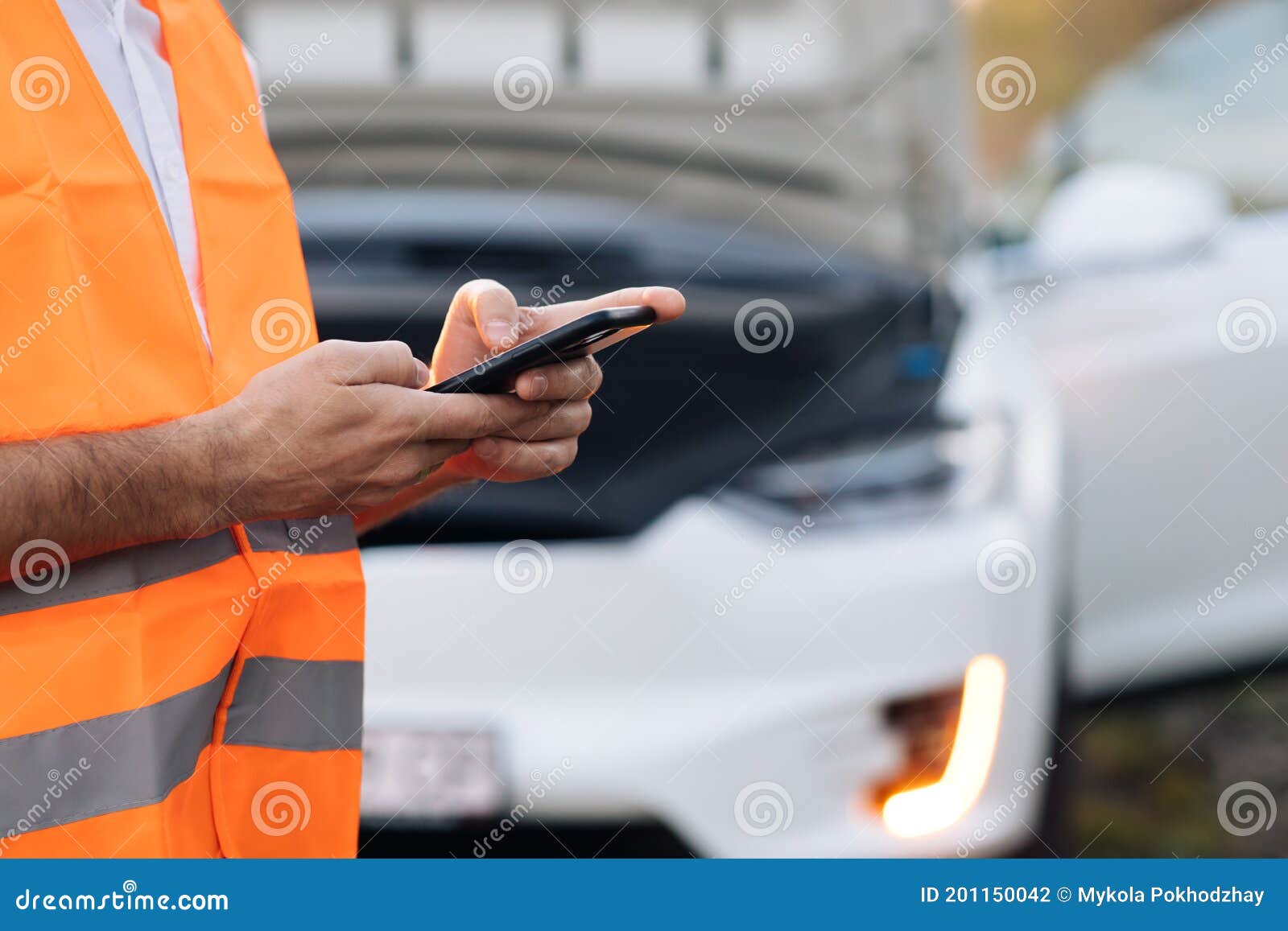 The Man Uses the Phone after the Electric Car Has Broken Down. Car ...