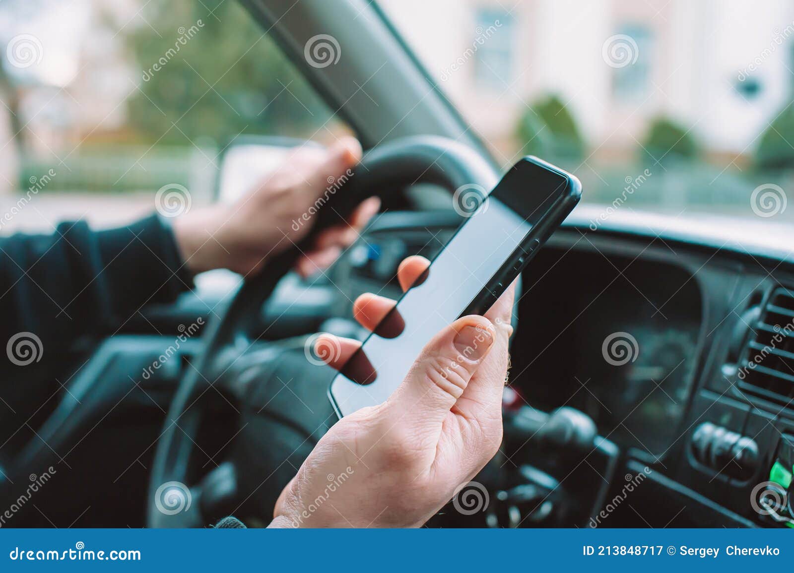 A Man Uses a Smartphone in a Car while Driving Stock Image - Image of ...
