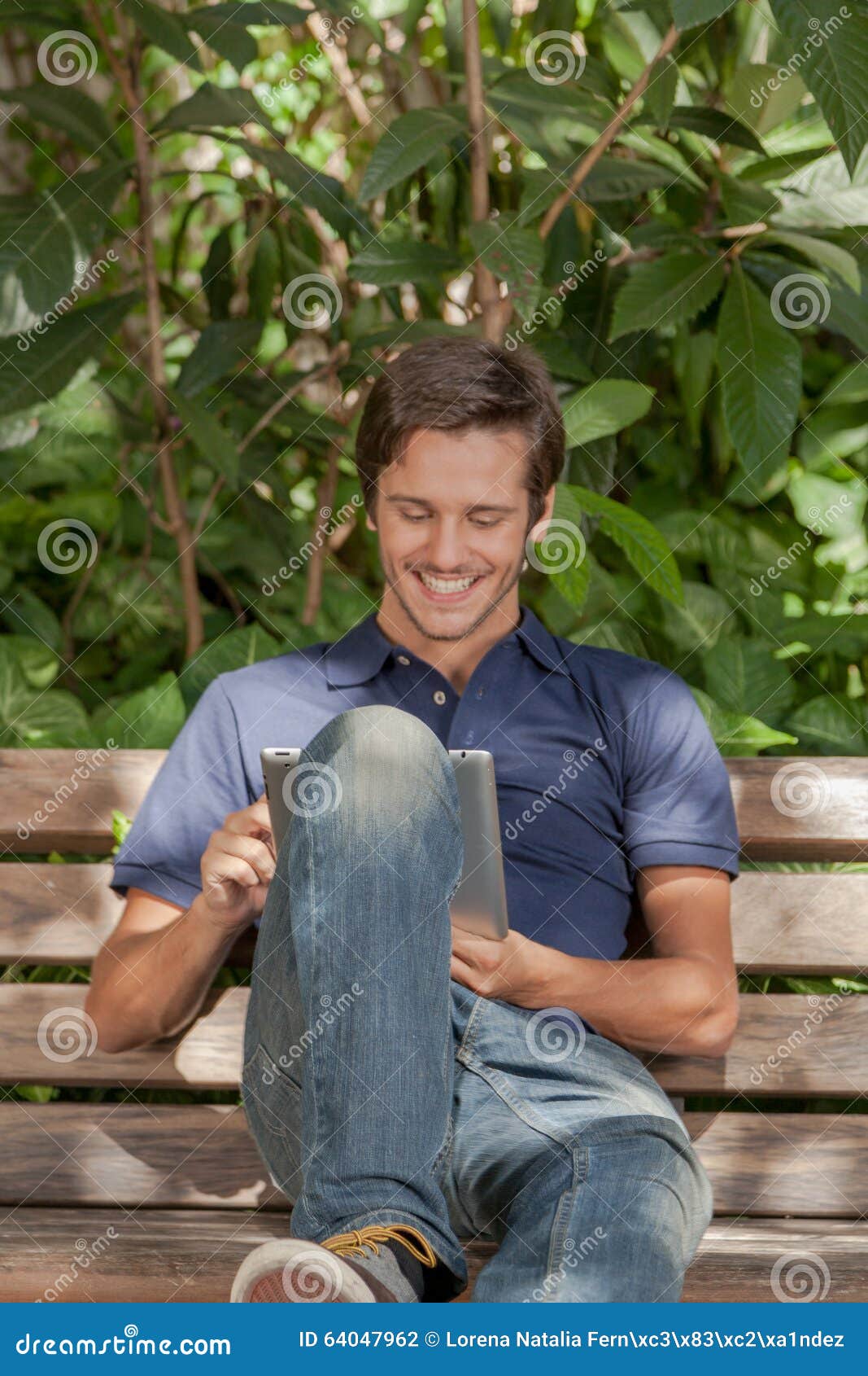 Man usign the ipad stock photo. Image of alone, cute - 64047962