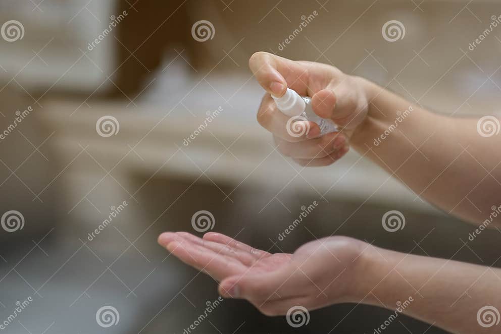 A Man Using Alcohol Spray for Cleaning Hands Stock Image - Image of ...