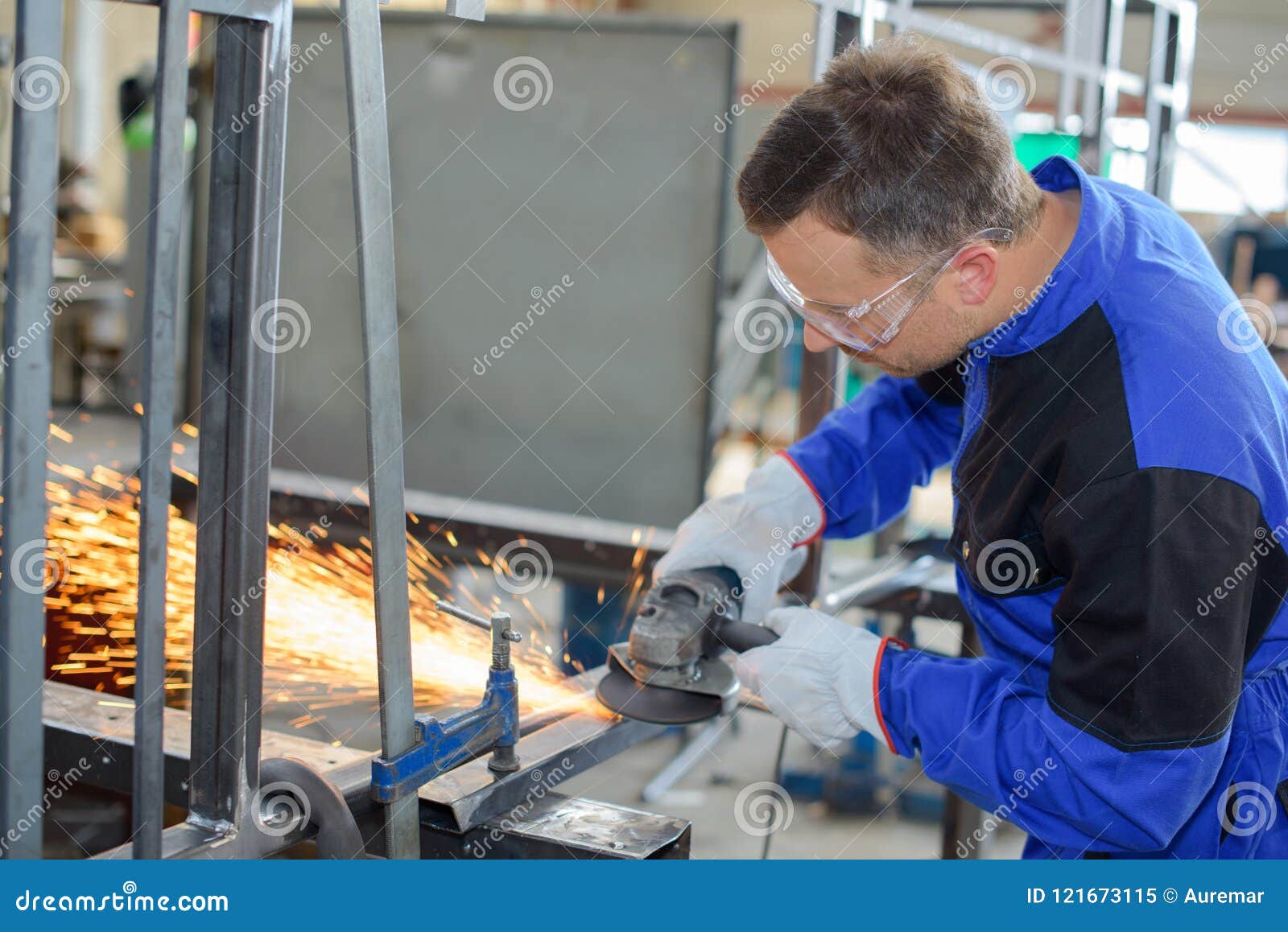 Man using angle grinder stock image. Image of goggles - 121673115