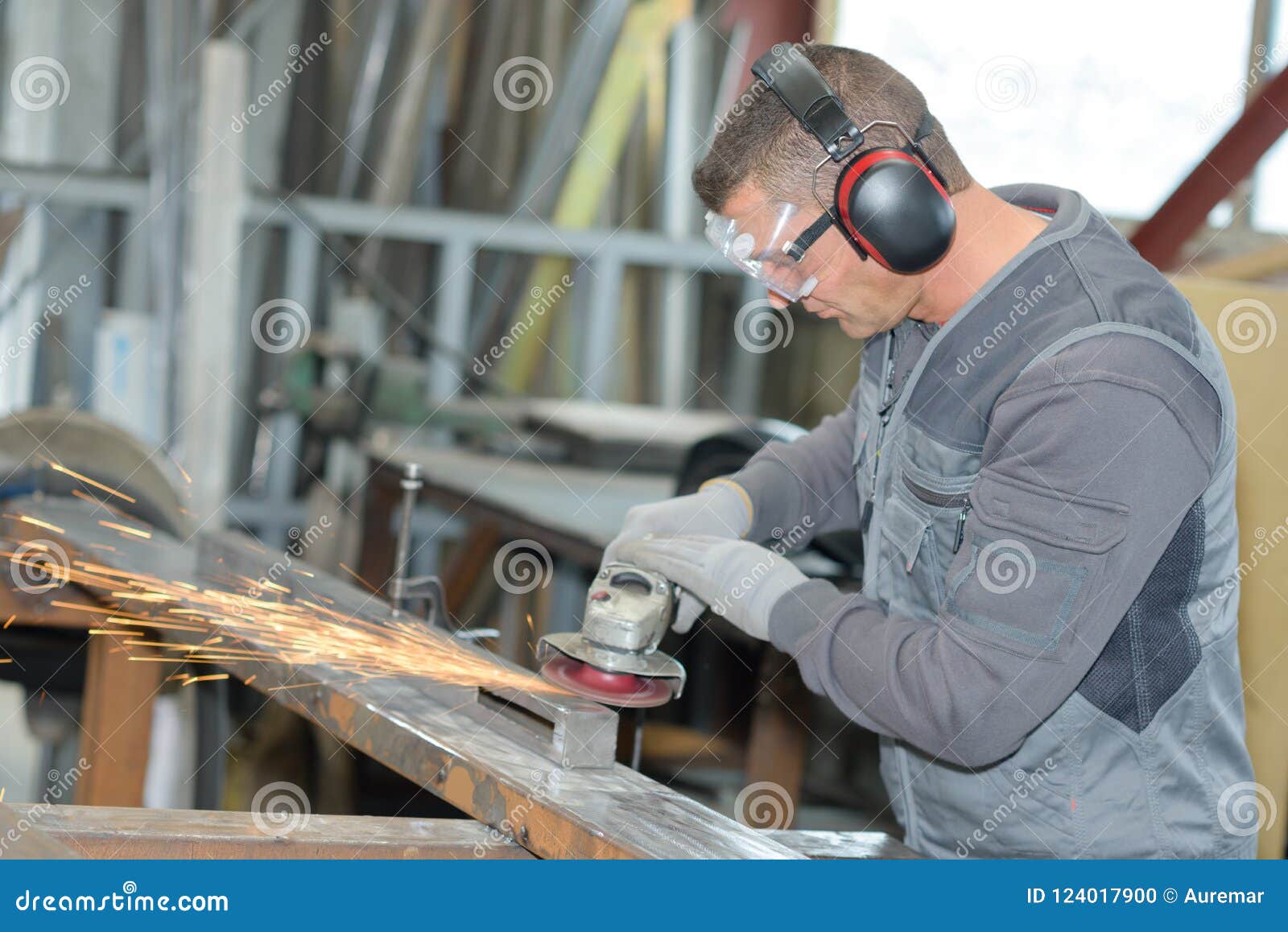 Man using angle grinder stock photo. Image of tool, protection - 124017900