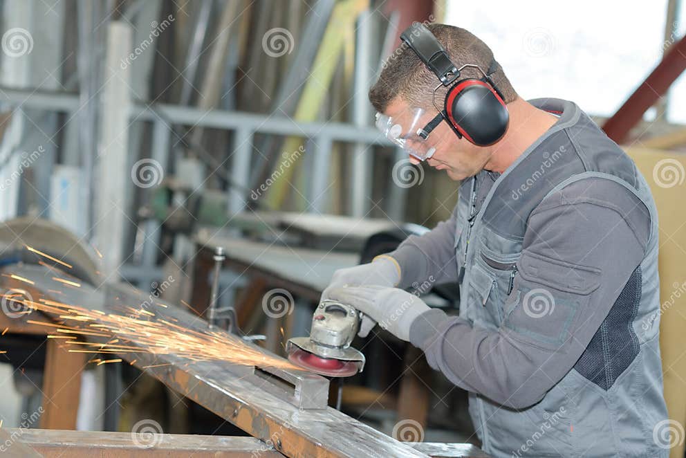 Man using angle grinder stock photo. Image of tool, protection - 124017900