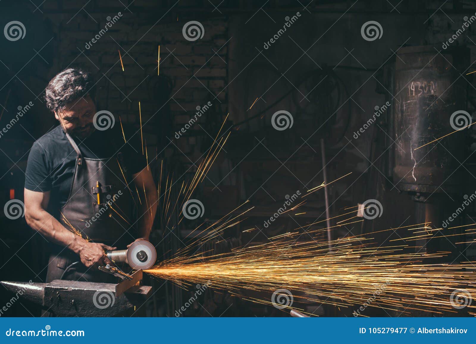 Man Using Angle Grinder in Factory and Throwing Sparks Stock Image ...