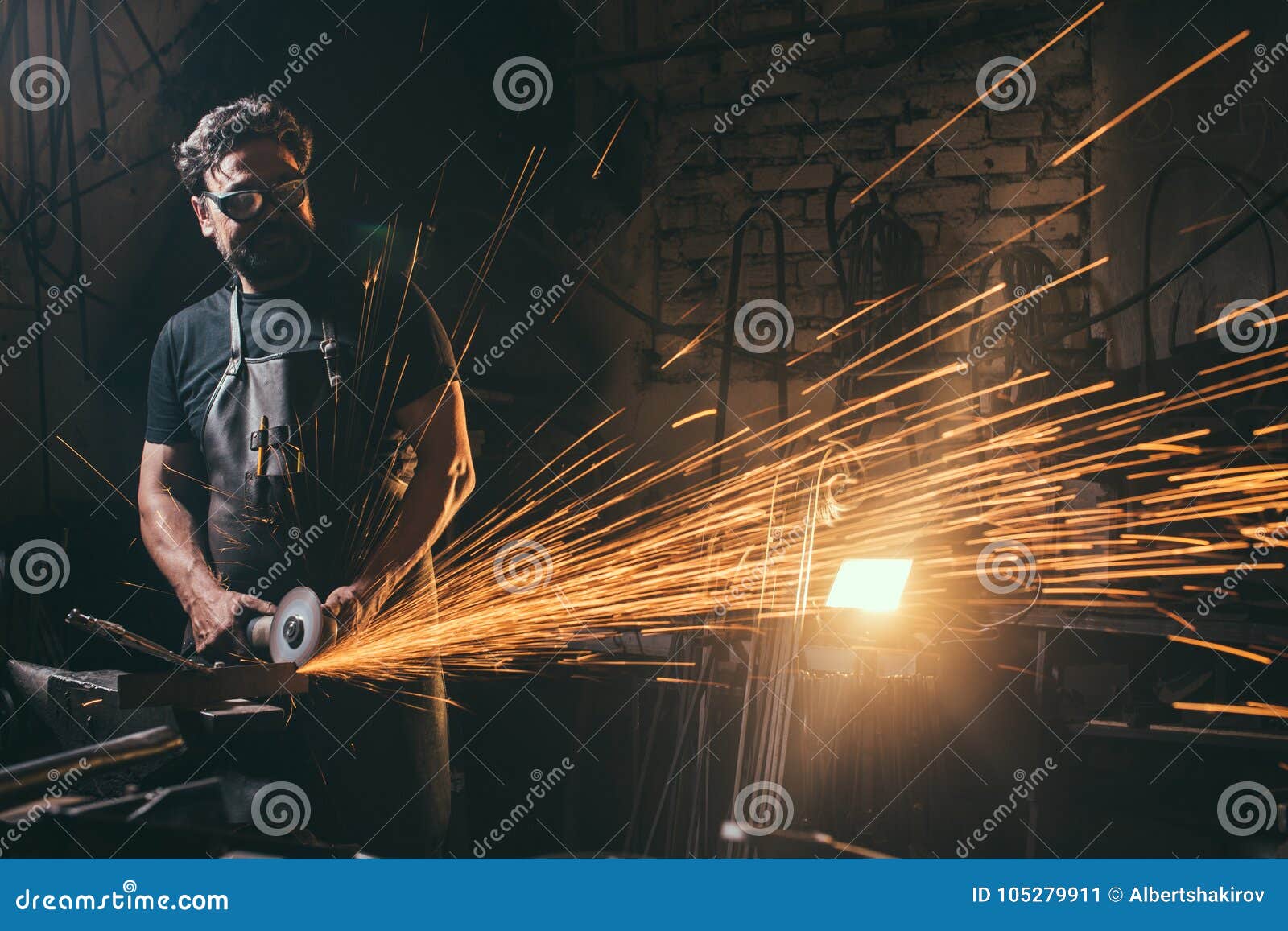 Man Using Angle Grinder in Factory and Throwing Sparks Stock Image ...