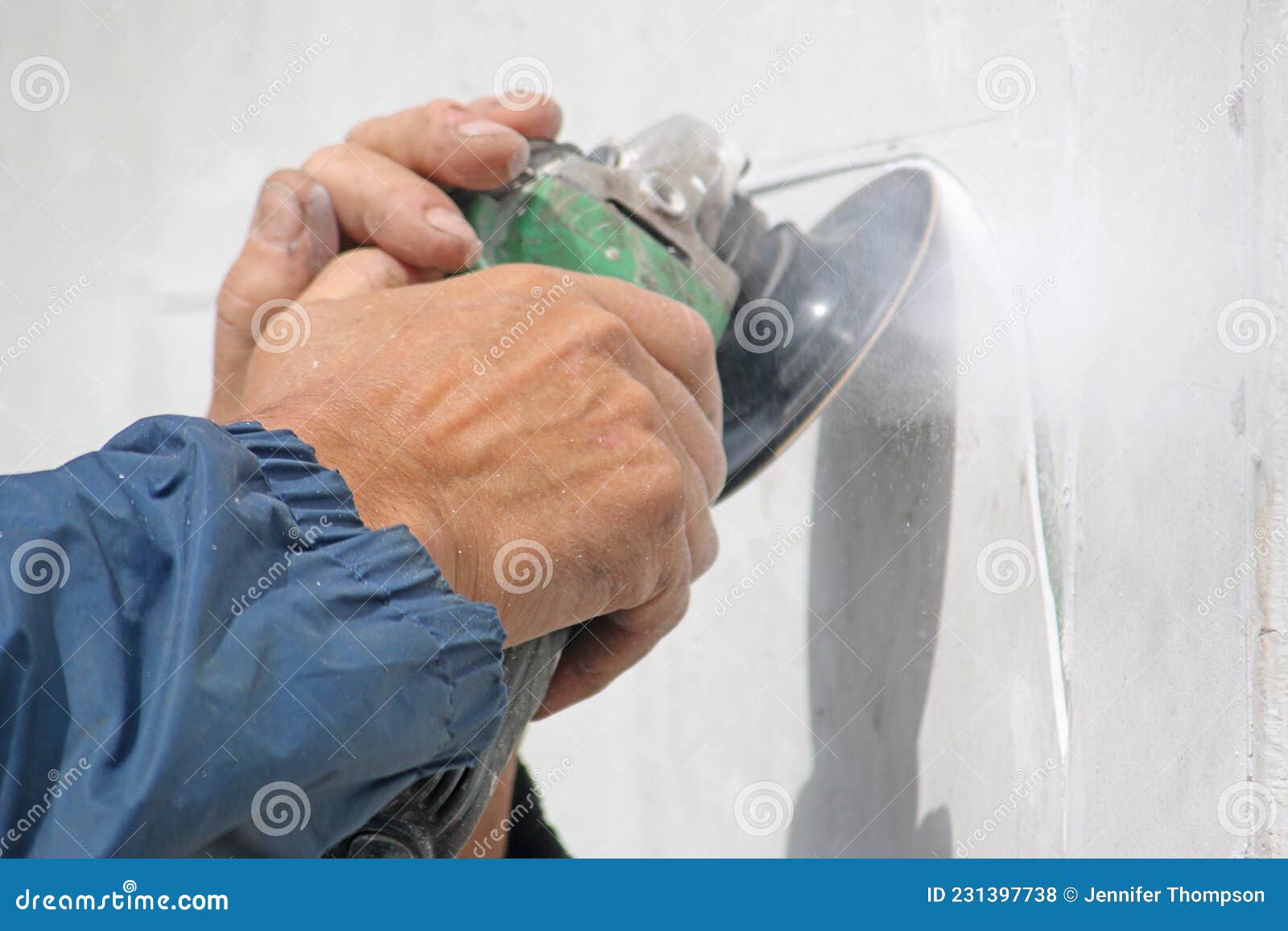Man using an angle grinder stock photo. Image of hand - 231397738