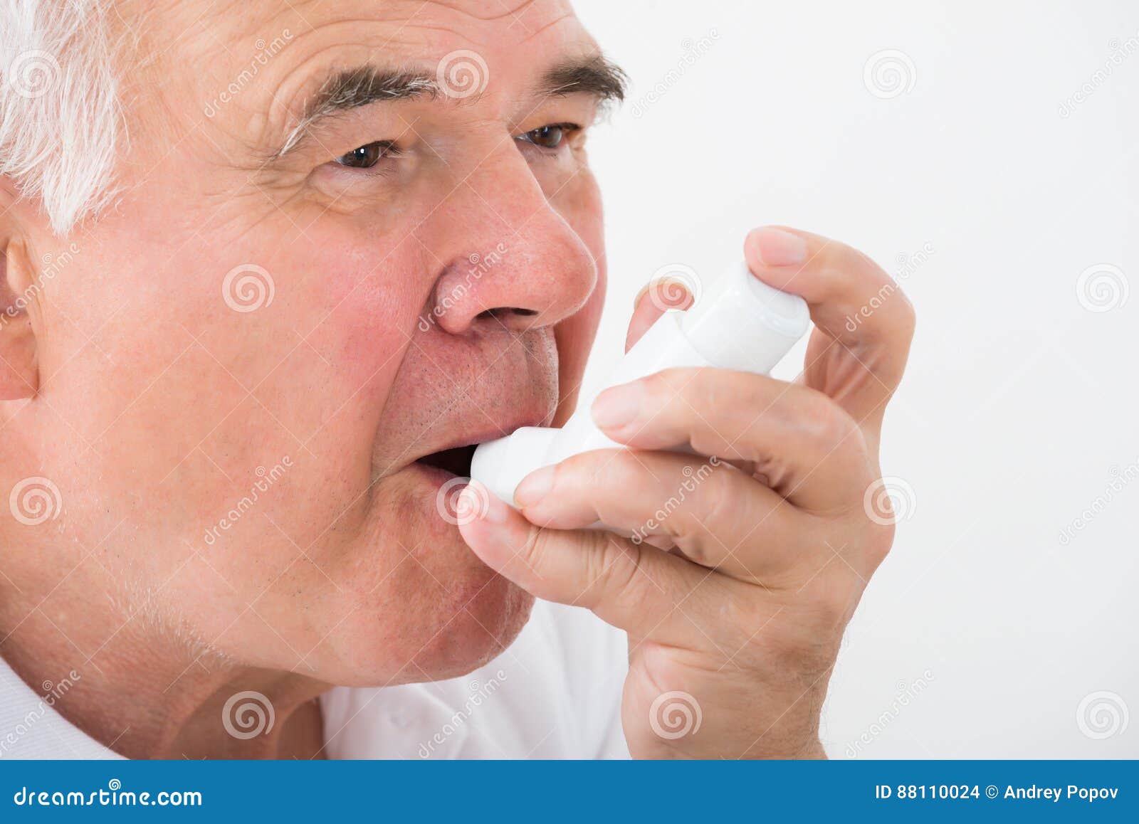 Man Using Asthma Inhaler stock photo. Image of dosage - 88110024