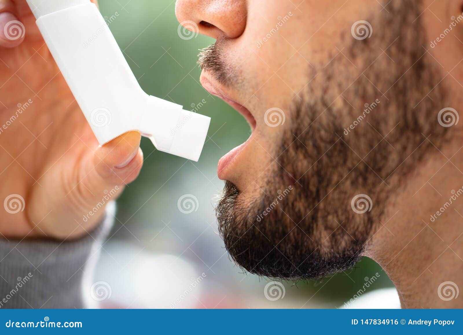 Man Using Asthma Inhaler stock photo. Image of asthma - 147834916