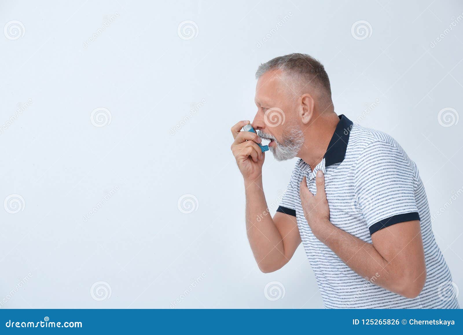 Man using asthma inhaler stock photo. Image of inhaler - 125265826