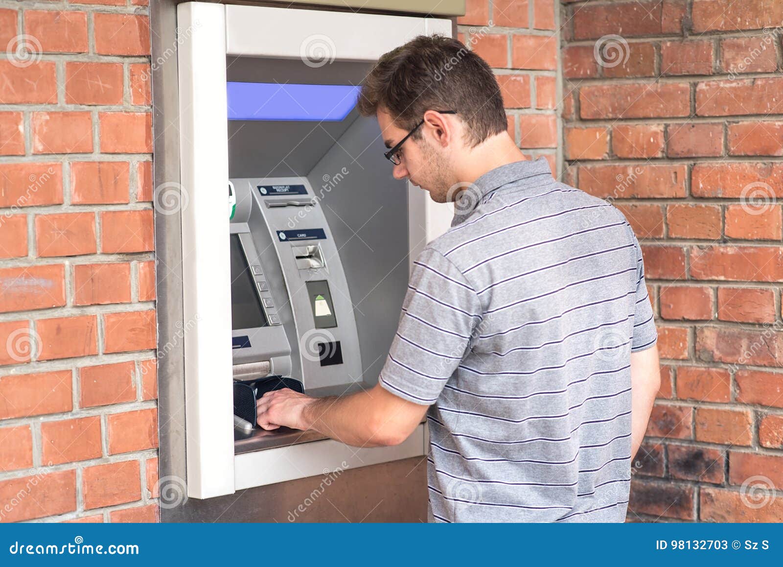 Man using ATM bank machine stock image. Image of automatic - 98132703