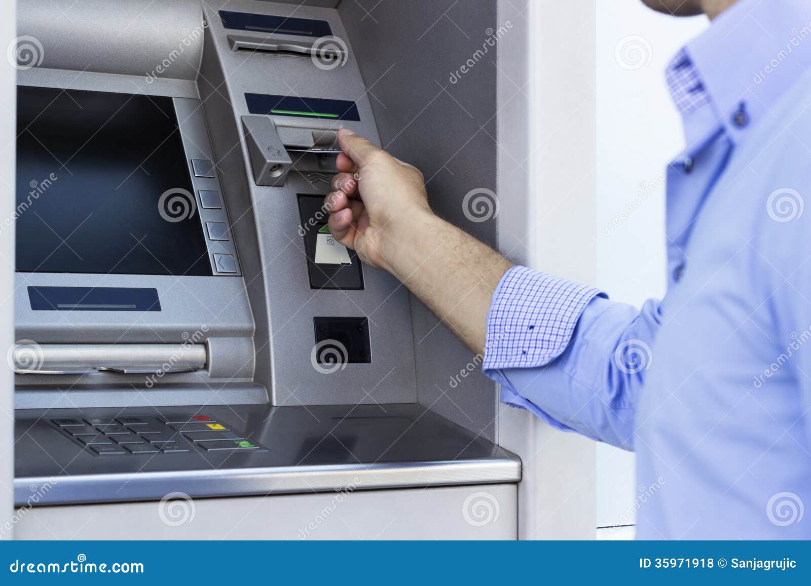 Man using a ATM stock photo. Image of holding, account - 35971918