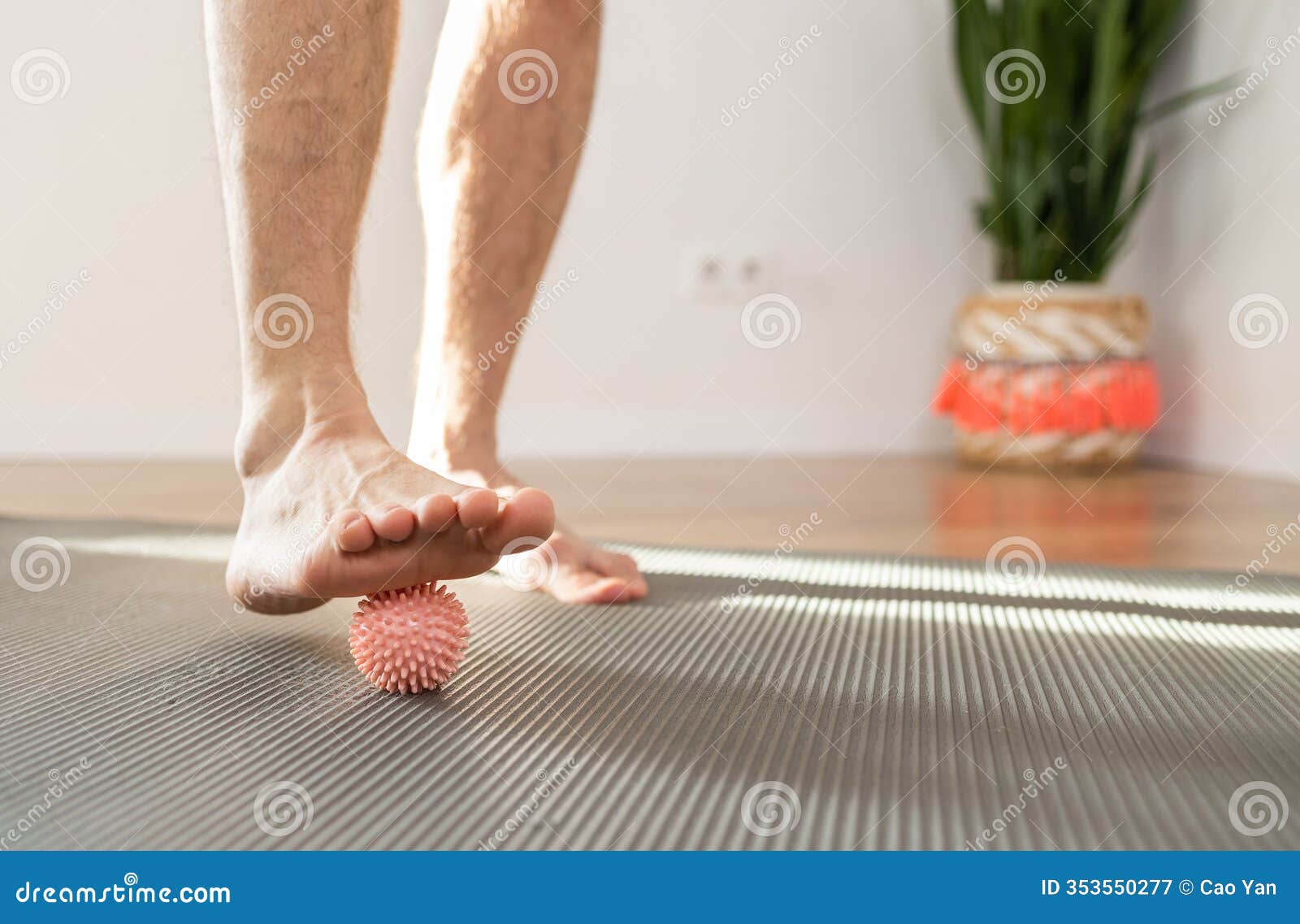Man Using Ball with Spikes for Foot Massage Doing Prevention Physical ...