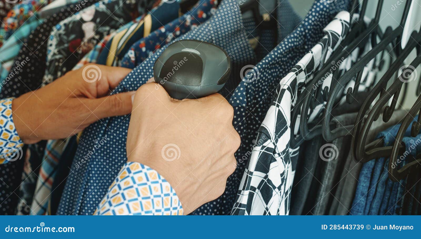 Man Using a Barcode Scanner in a Clothes Shop, Banner Stock Image ...