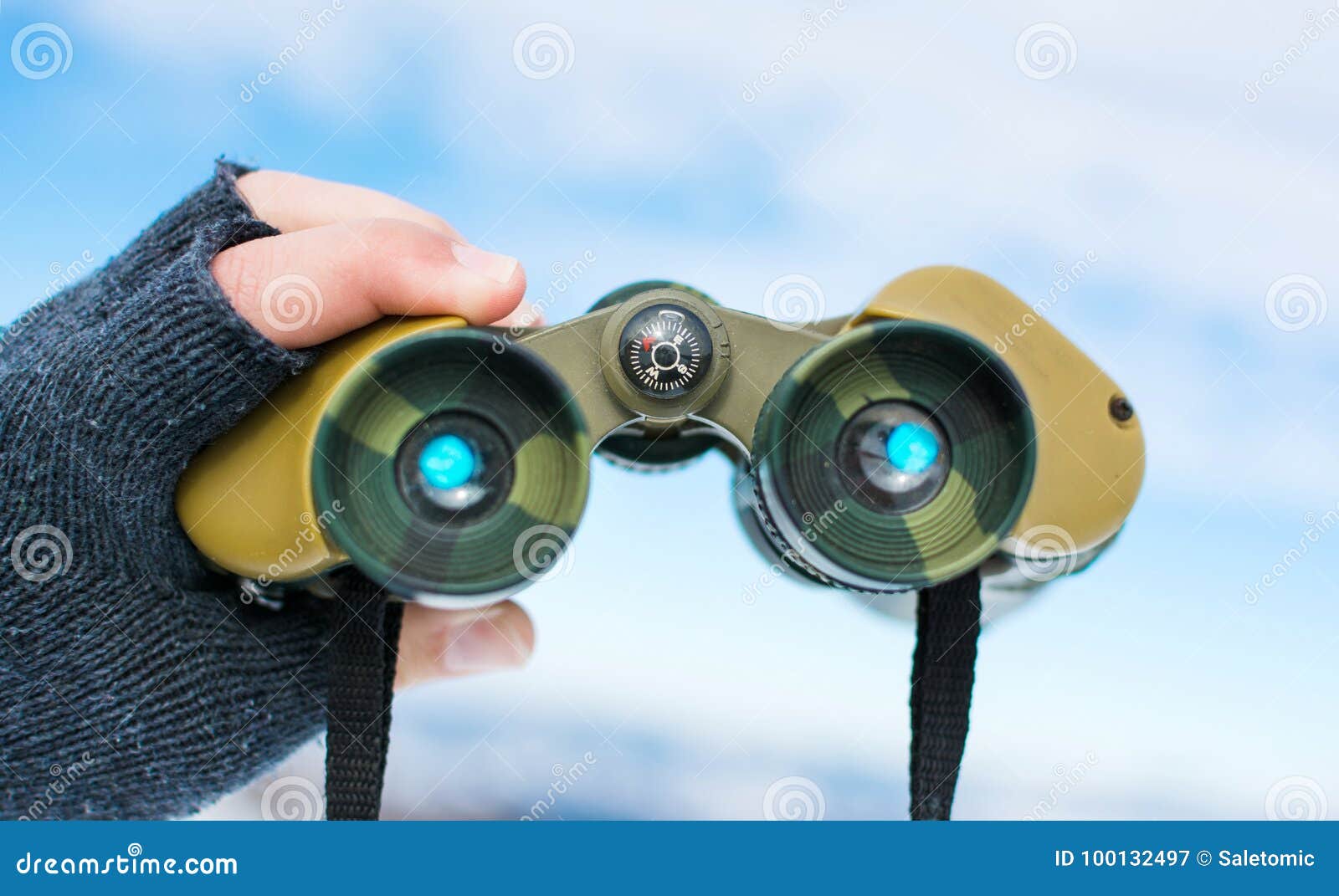 Man Using Binoculars on Snow Covered Mountain Stock Image - Image of ...