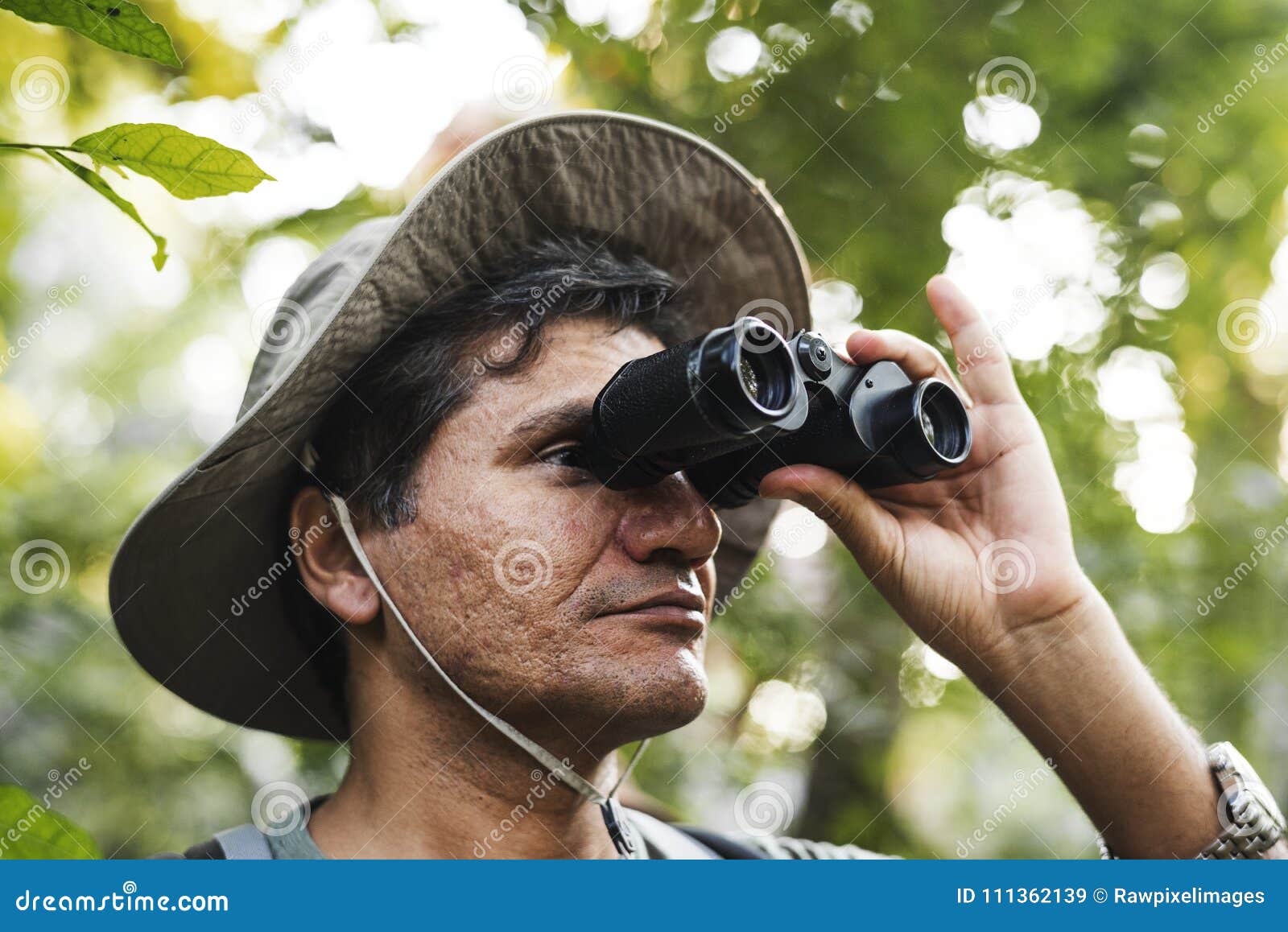 Man Using Binoculars while Trekking in Forest Stock Image - Image of ...