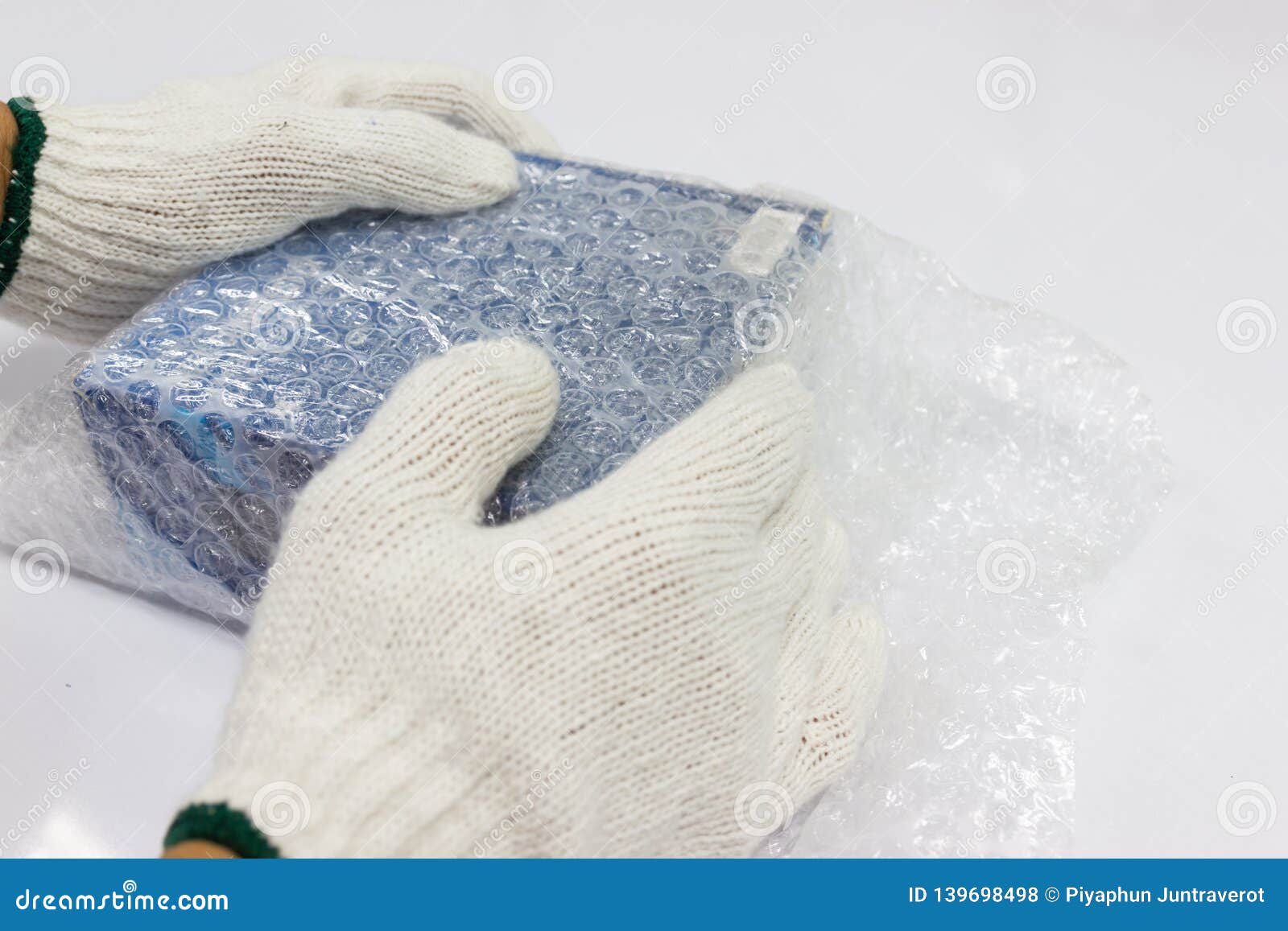 Man are Using a Bubble Wrap Wrapped Packing and Protection Brown Box ...