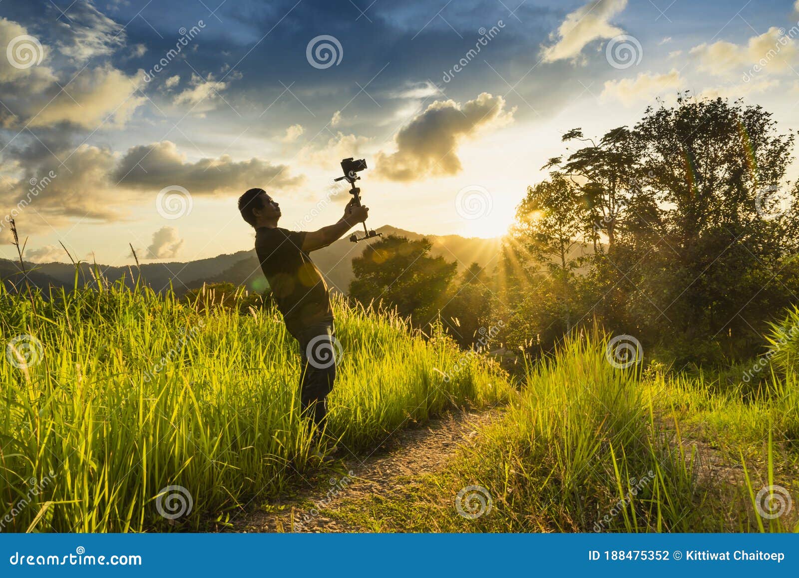 A man is using a camera. stock photo. Image of occupation - 188475352