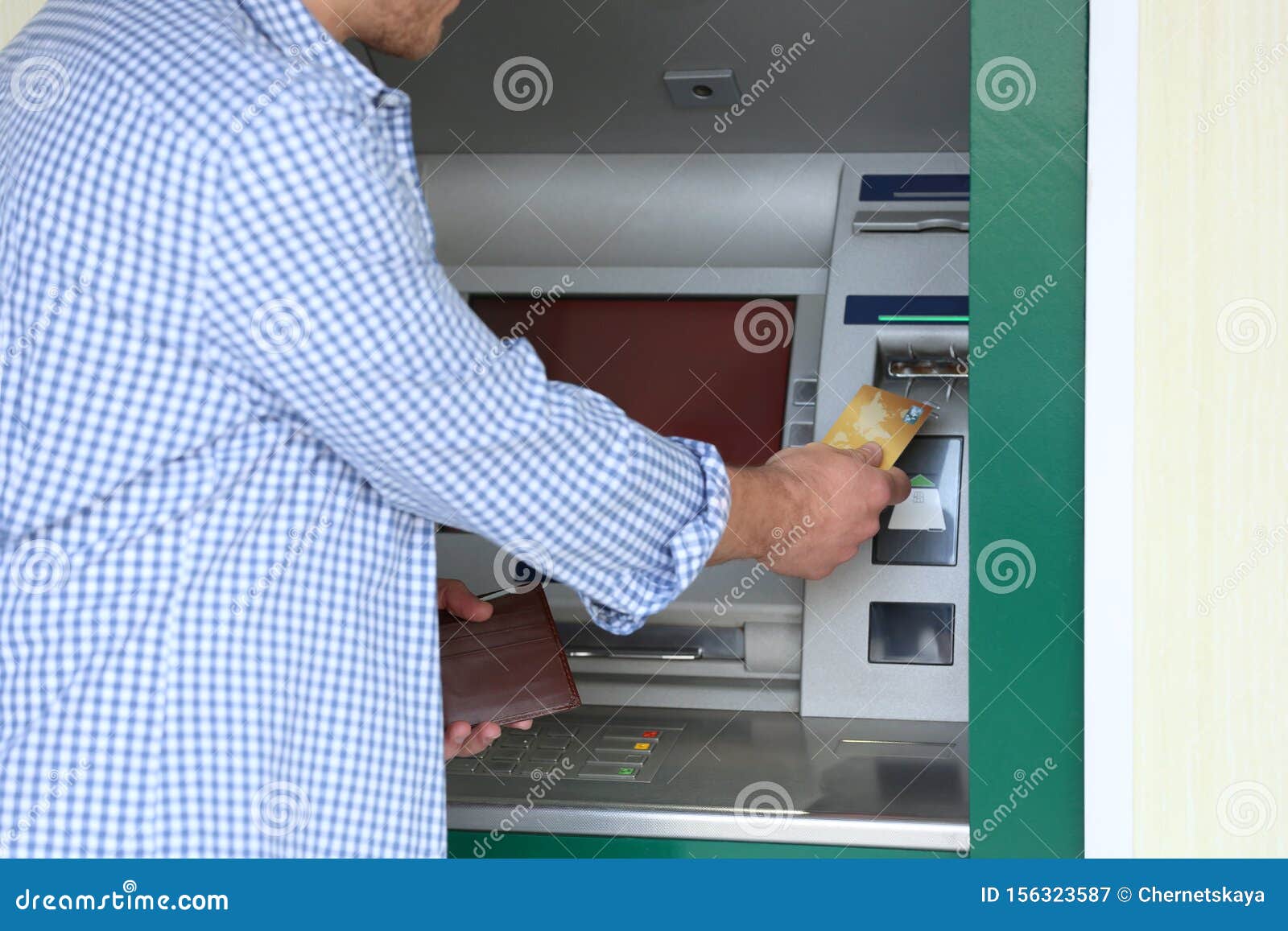 Man Using Cash Machine for Money Withdrawal Outdoors Stock Image ...