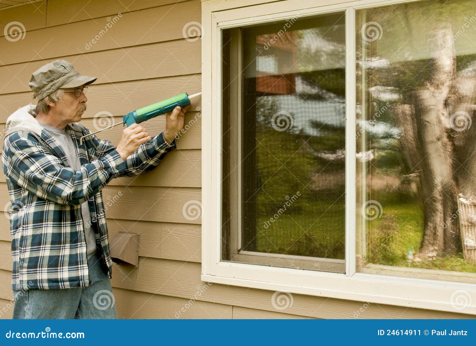 Man using a caulking gun stock image. Image of tool, sealant - 24614911