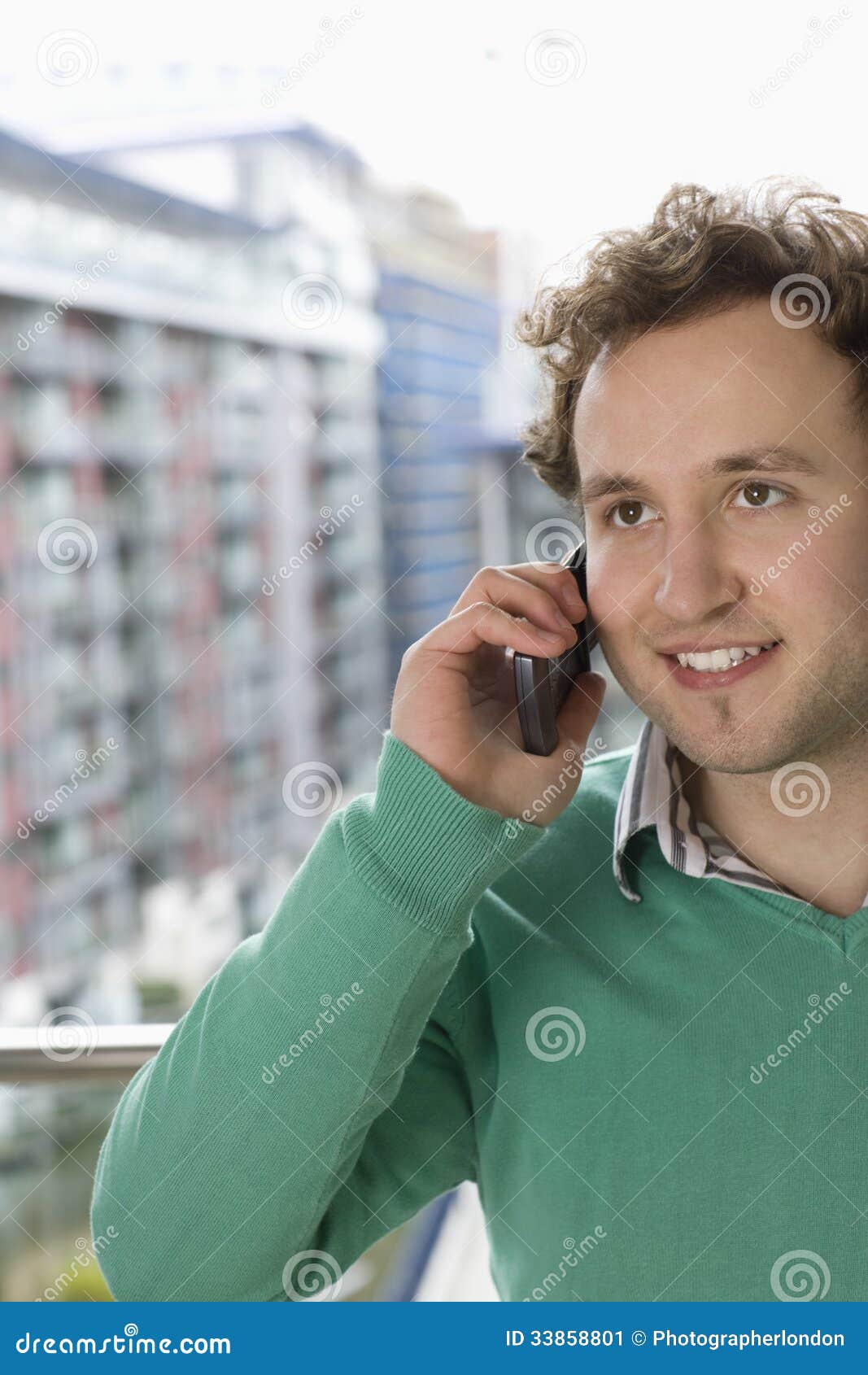 Man Using Cell Phone on Balcony Stock Image - Image of lifestyle, green ...