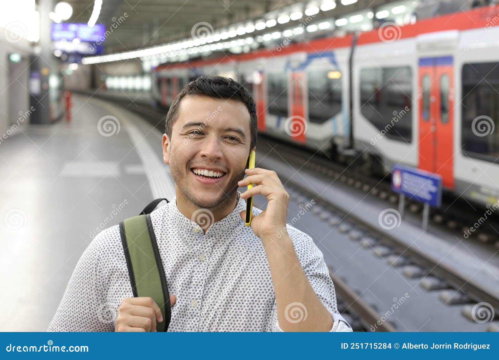 Man Using Cellphone in Train Station Stock Photo - Image of cell ...