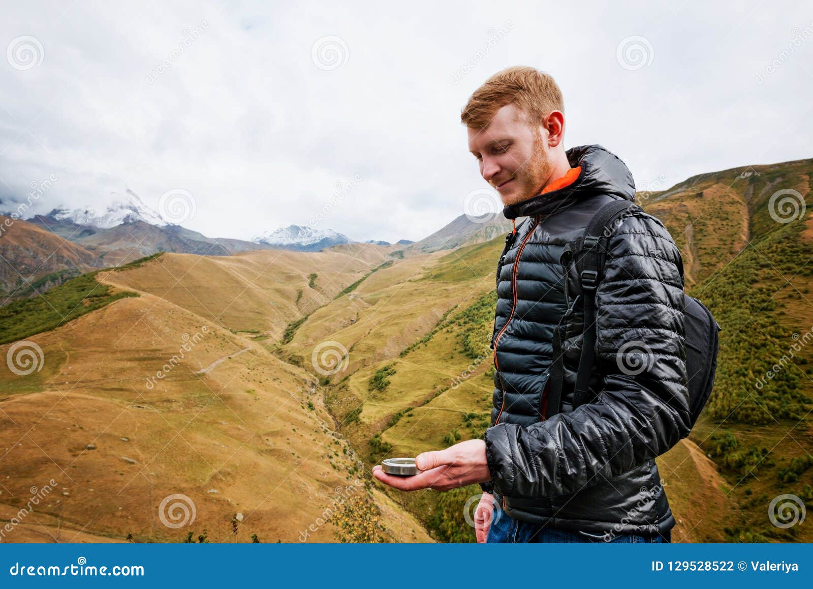 Man using a compass stock photo. Image of tourism, mountains - 129528522