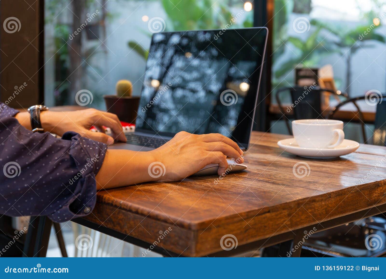 Man Using Computer Mouse Working on Laptop at Table in Cafe. Stock ...