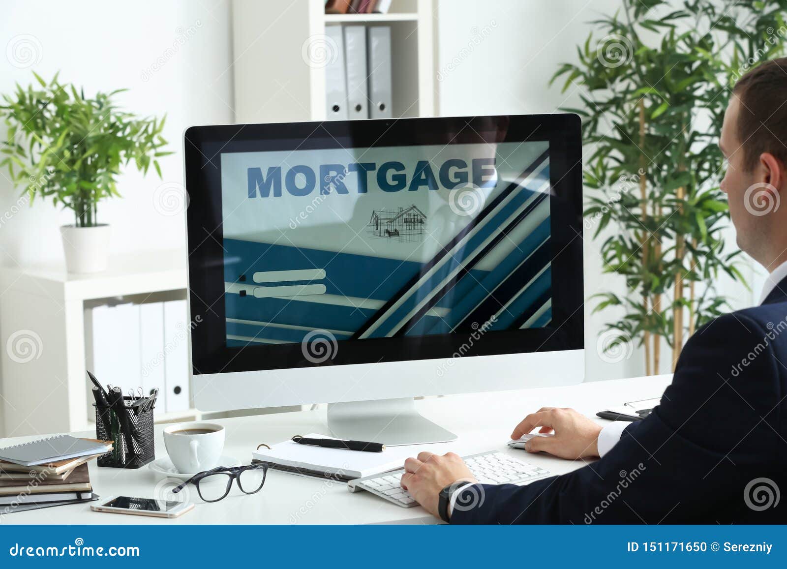 Man Using Computer To Pay Mortgage Loan Online in Office Stock Photo ...
