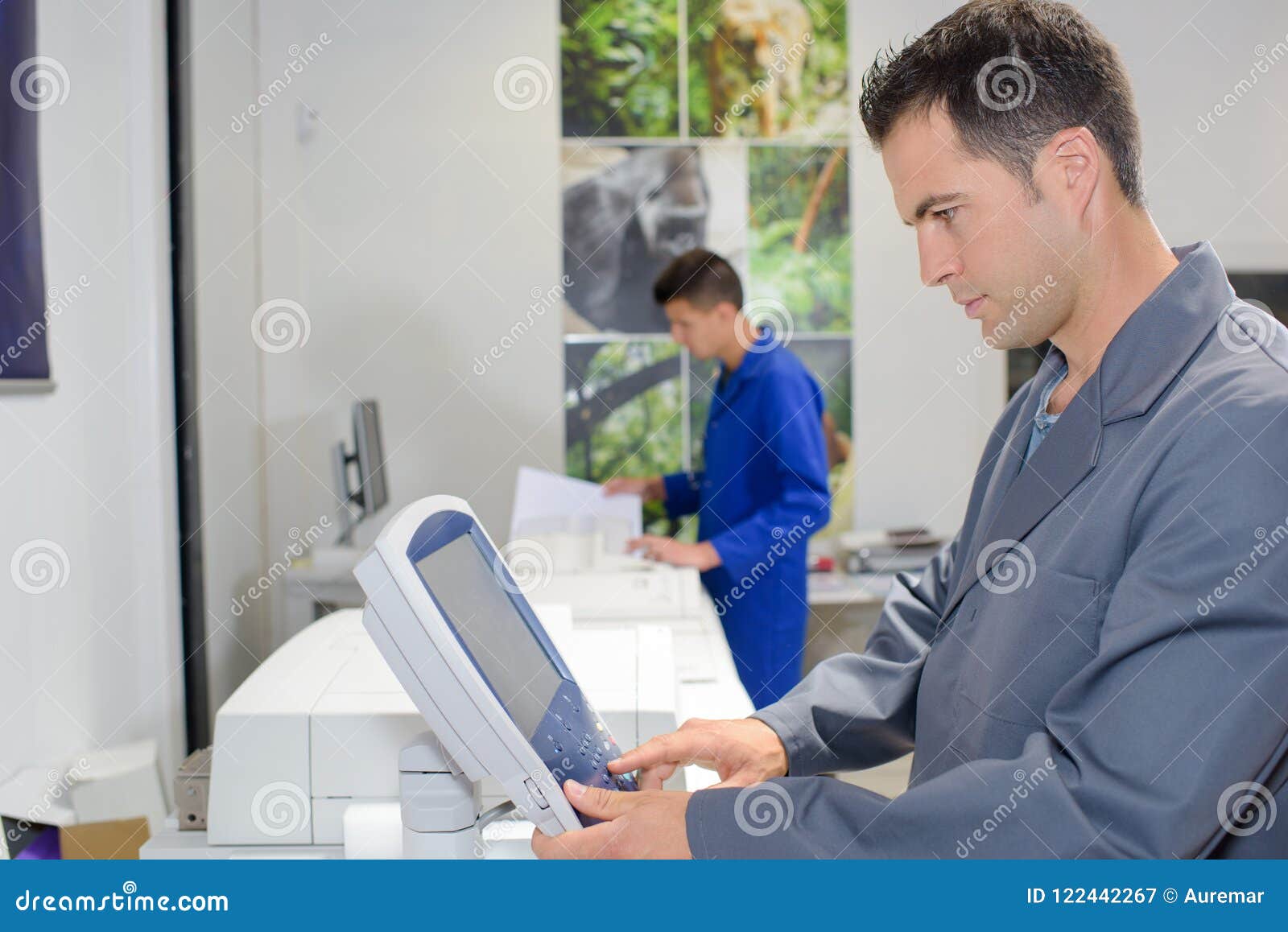 Man Using Control Pad on Printer Stock Image - Image of system, modern ...