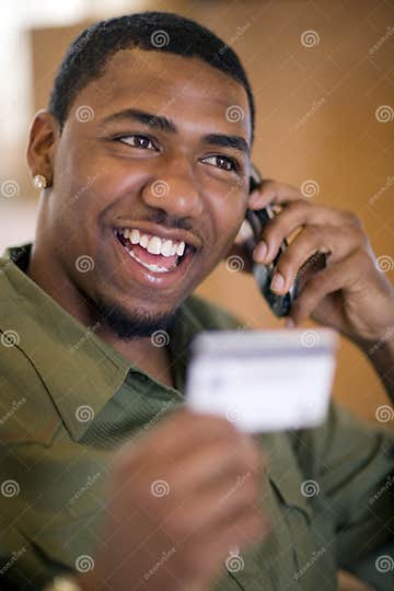 Man Using Credit Card and Cell Phone Stock Photo - Image of credit ...