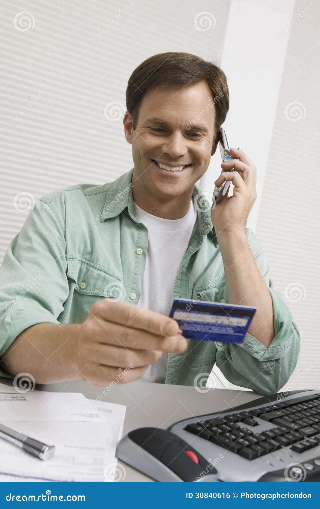 Man Using Credit Card To Order Over Phone Stock Photo - Image of 3035 ...