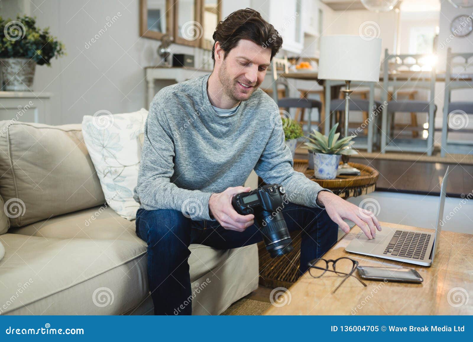 Man Using Digital Camera in Living Room Stock Image - Image of living ...