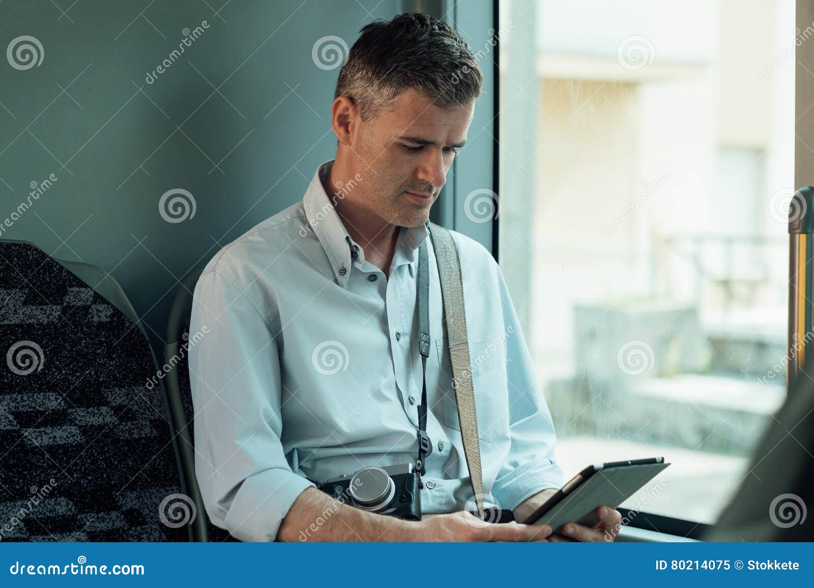 Man Using a Digital Tablet on a Bus Stock Image - Image of portable ...