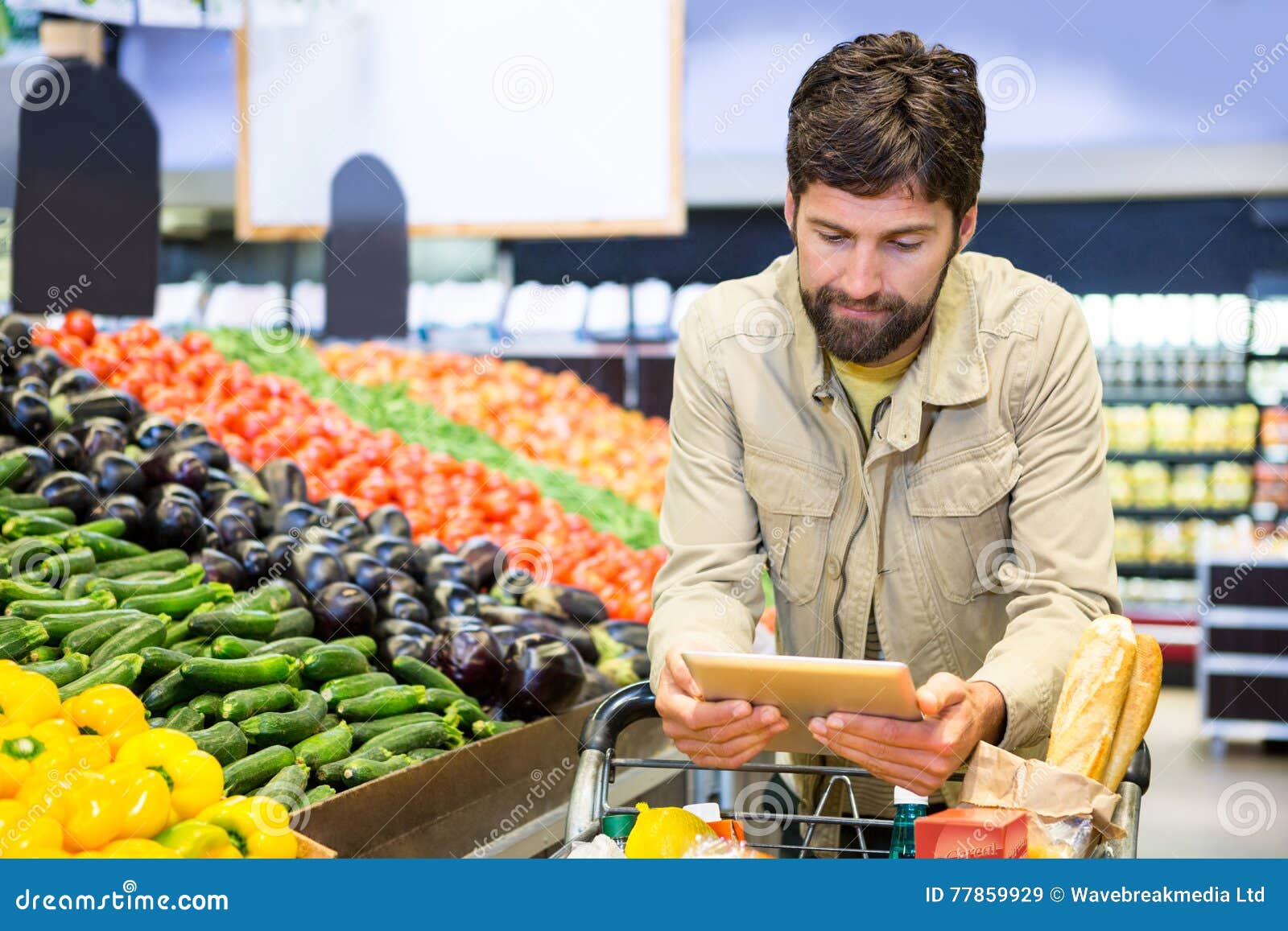 Man Using Digital Tablet while Shopping Stock Image - Image of business ...