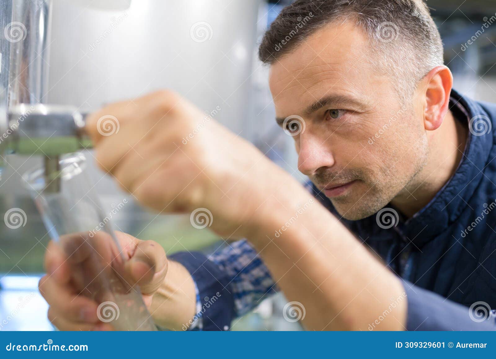 Man using draught pump stock image. Image of concentration - 309329601