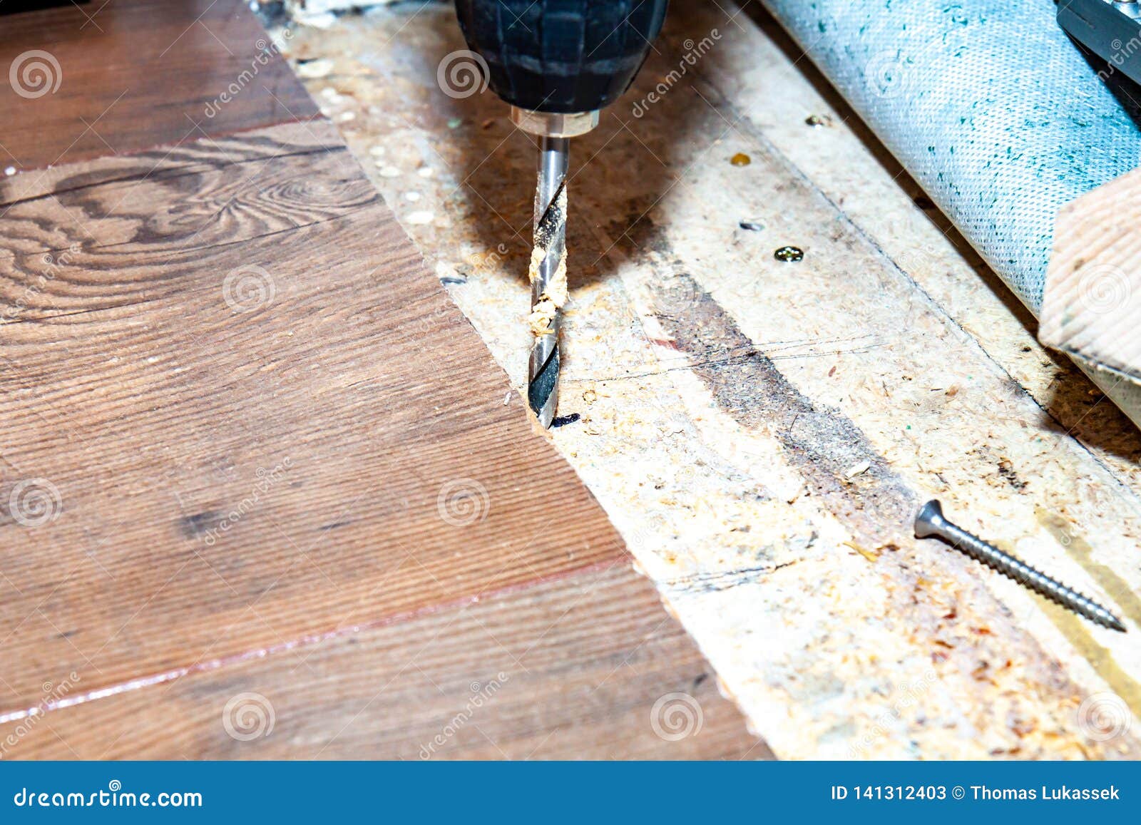 Man Using Drill Machine while Installing New Wooden Laminate Flooring ...
