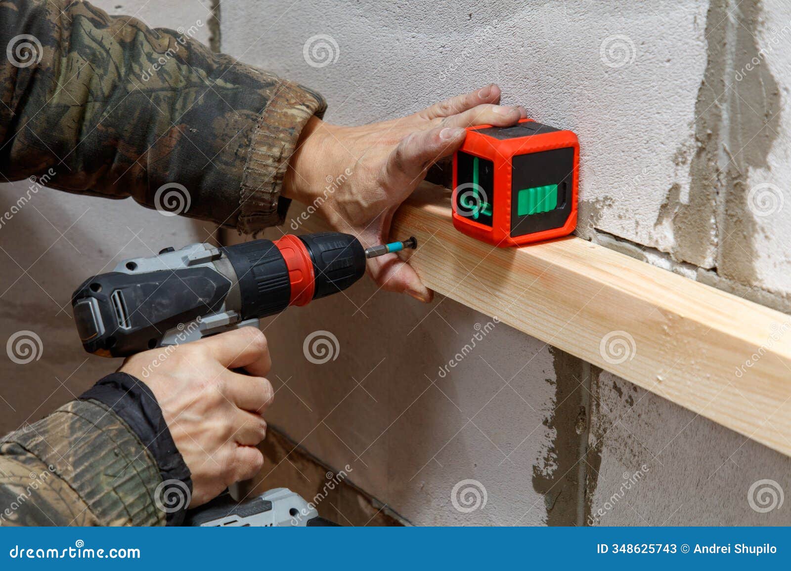 A Man is Using a Drill To Make a Hole in a Wall Stock Image - Image of ...