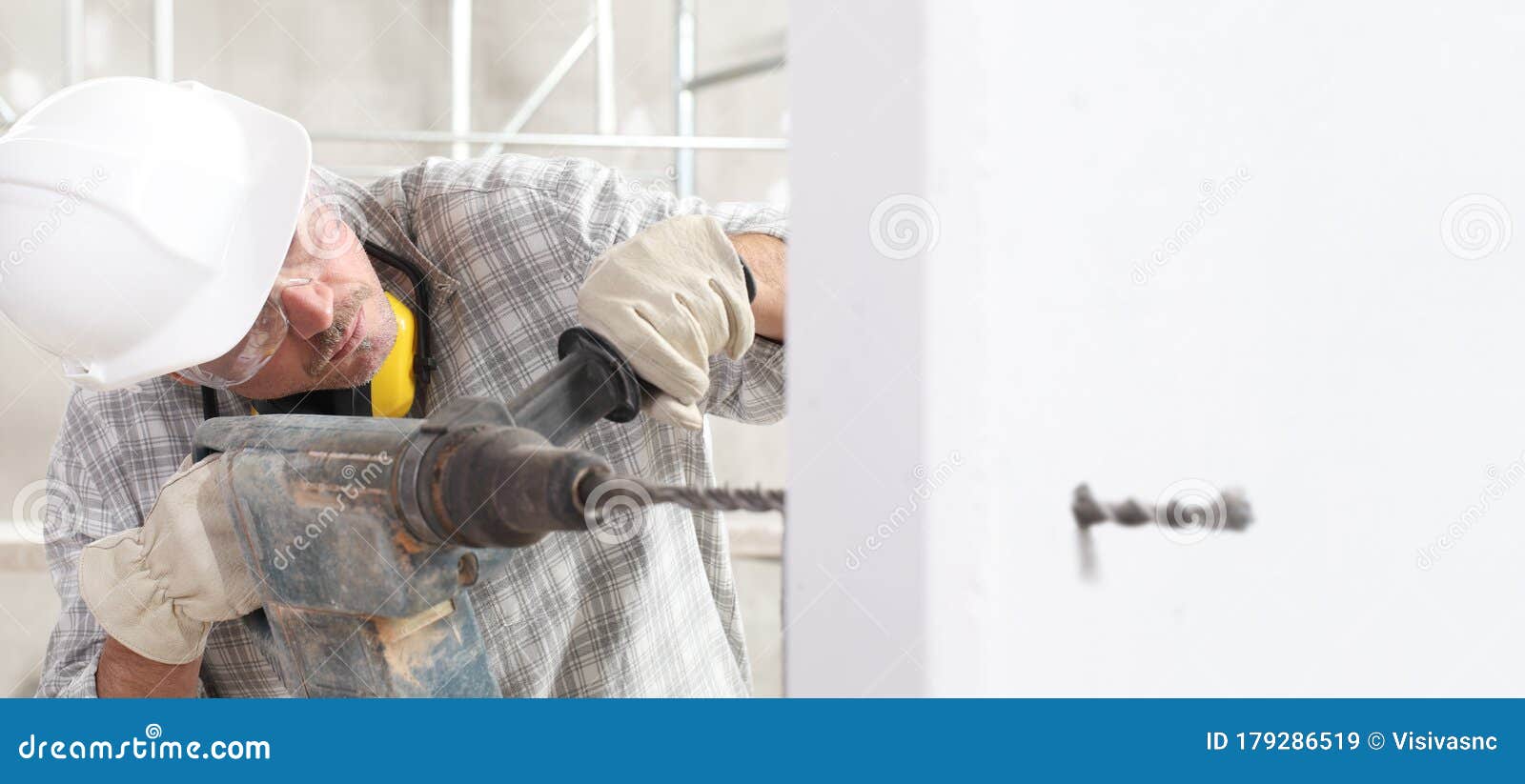 Man Using an Electric Pneumatic Drill Making a Hole in Wall ...