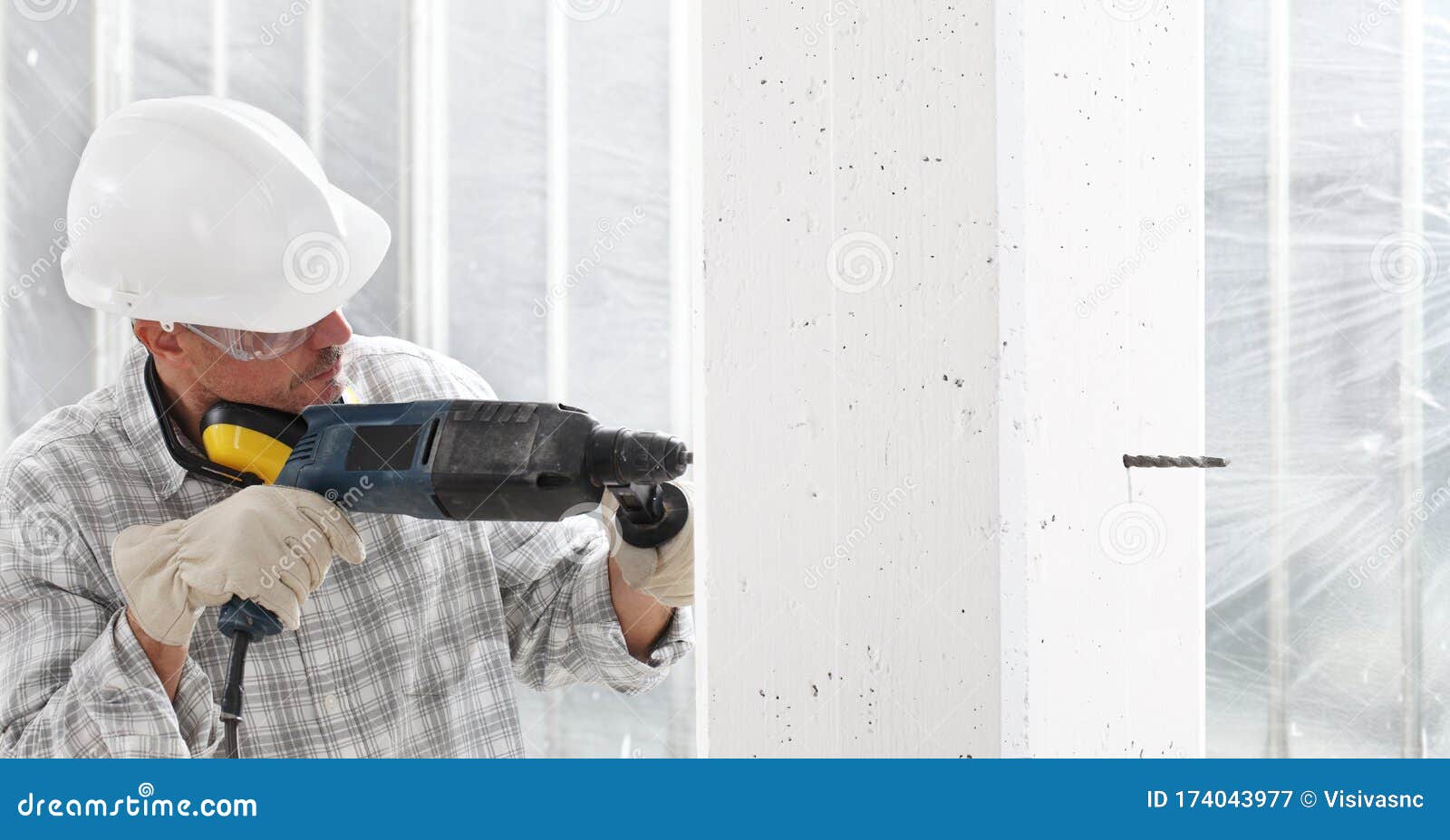 Man Using an Electric Pneumatic Drill Making a Hole in Wall ...