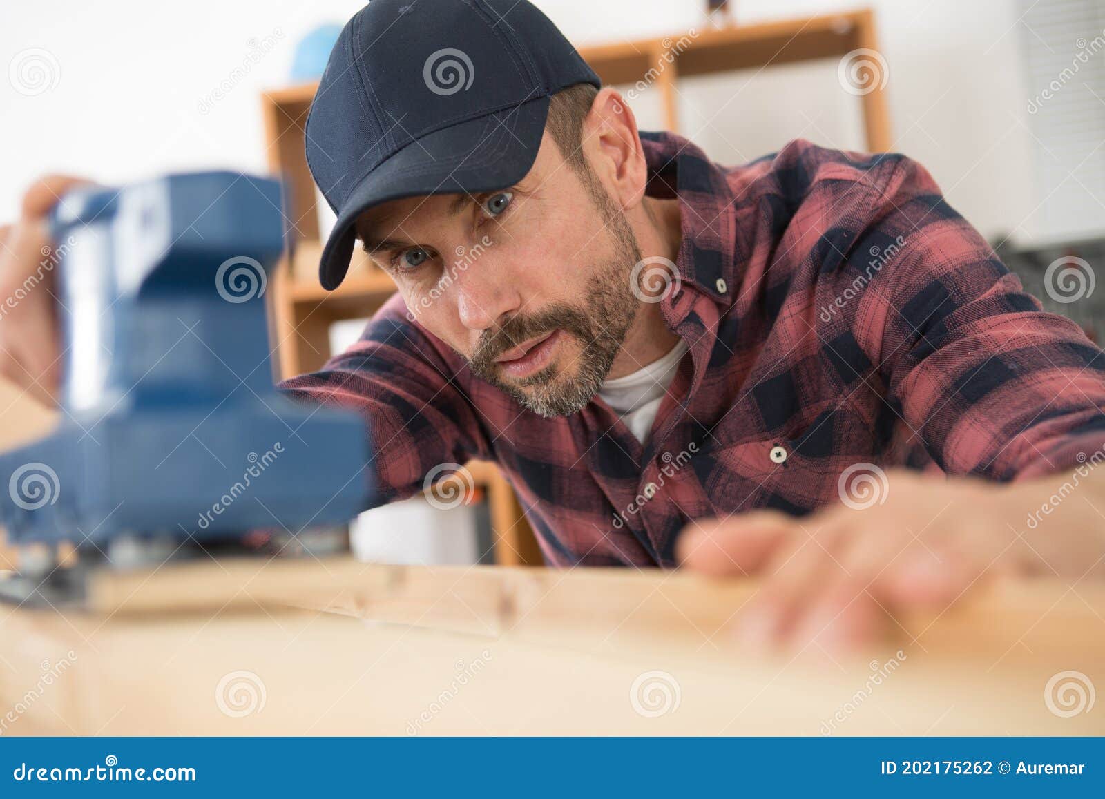 Man using electric sander stock photo. Image of professional - 202175262