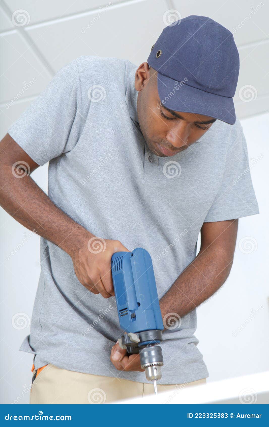 Man using electrical drill stock image. Image of subcontractor - 223325383