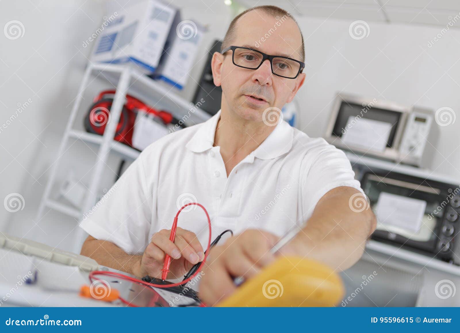 Man Using Electronic Measuring Instrument Stock Image - Image of device ...