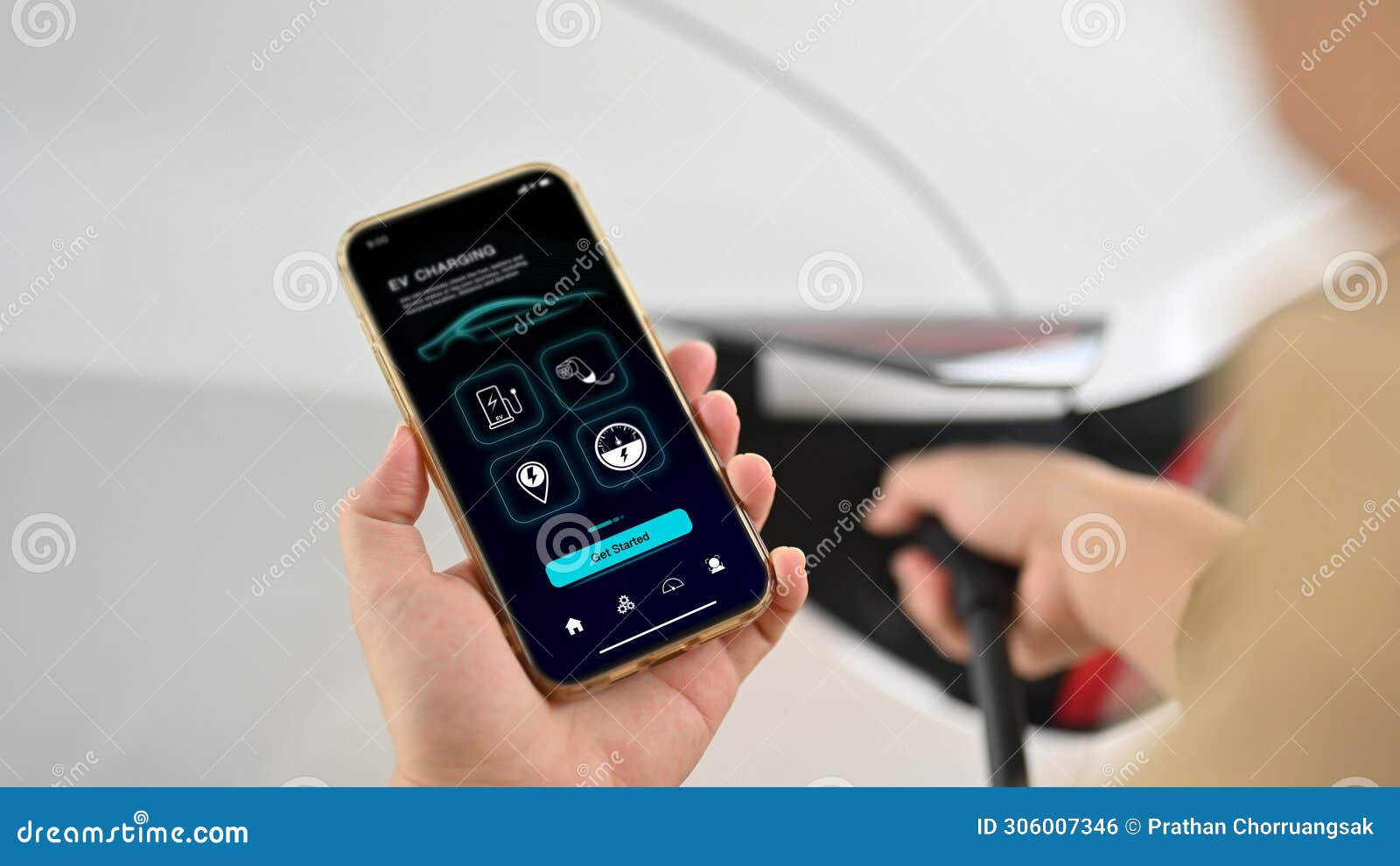 Man Using EV Application on His Phone To Check Charging Status while ...