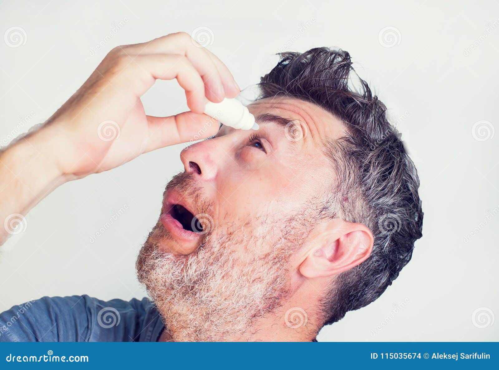 Man Using Eye Drops in Eyes Stock Photo - Image of lifestyle, adult ...